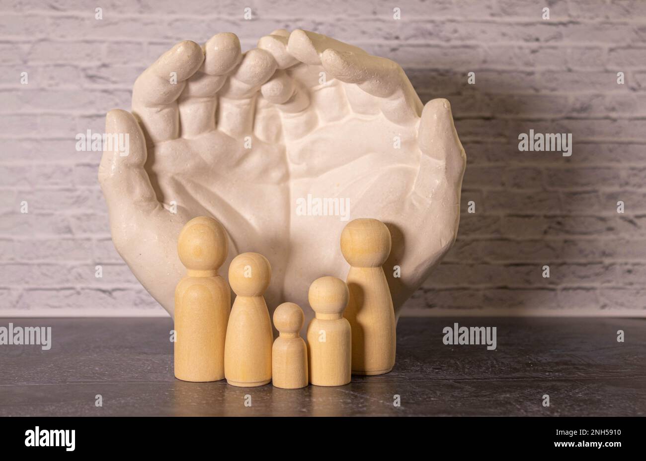 Small wooden figures of family members. Family relationship symbol ...