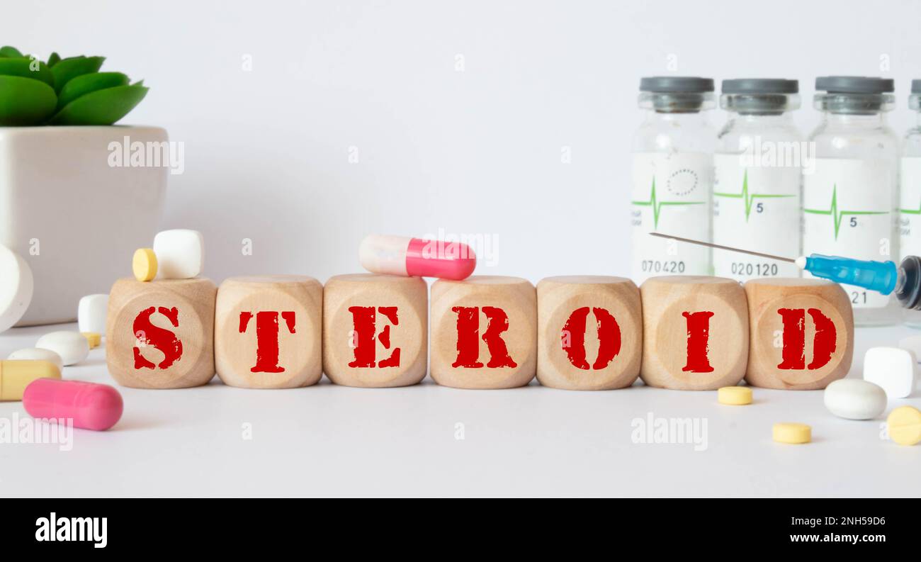 Word STEROID made from wooden letters on grey backgound. Plant on ...