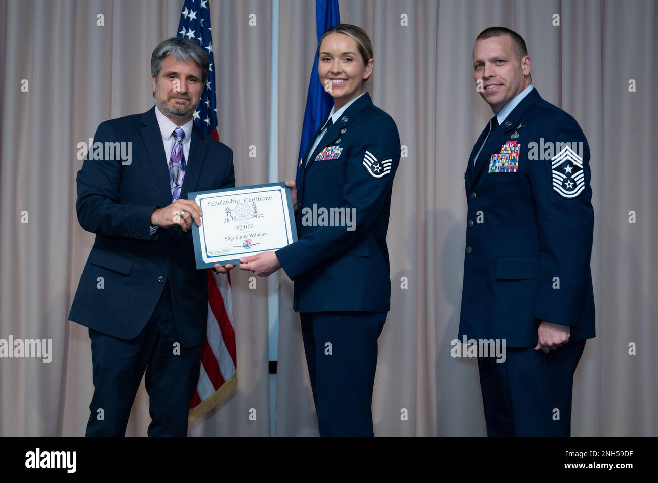 Jamie Thurber, Lexington-Concord chapter of AFCEA president, presents ...