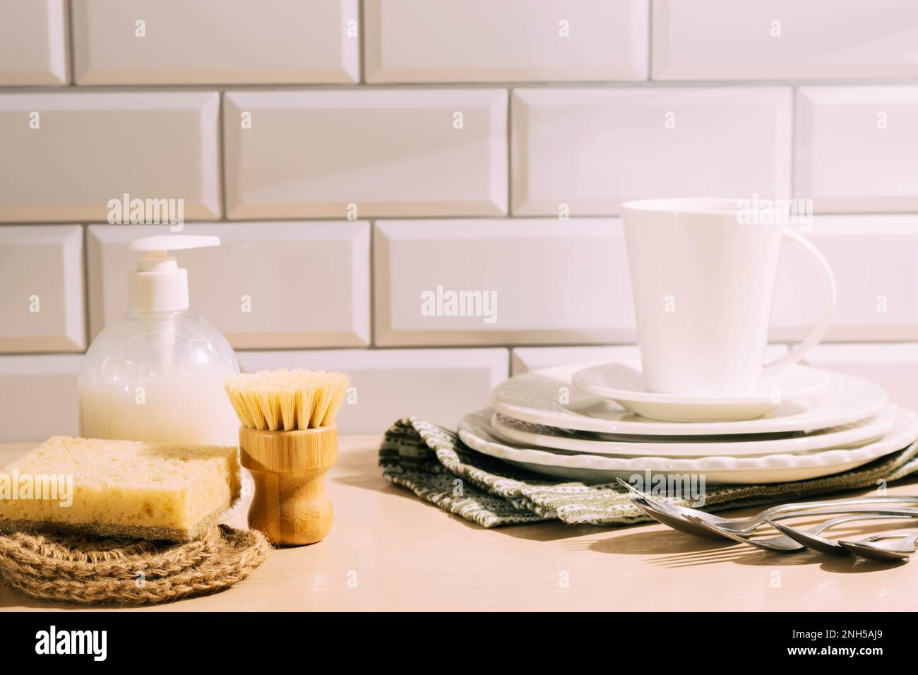 Liquid detergent, natural sponges, dishwashing brush, clean white ...