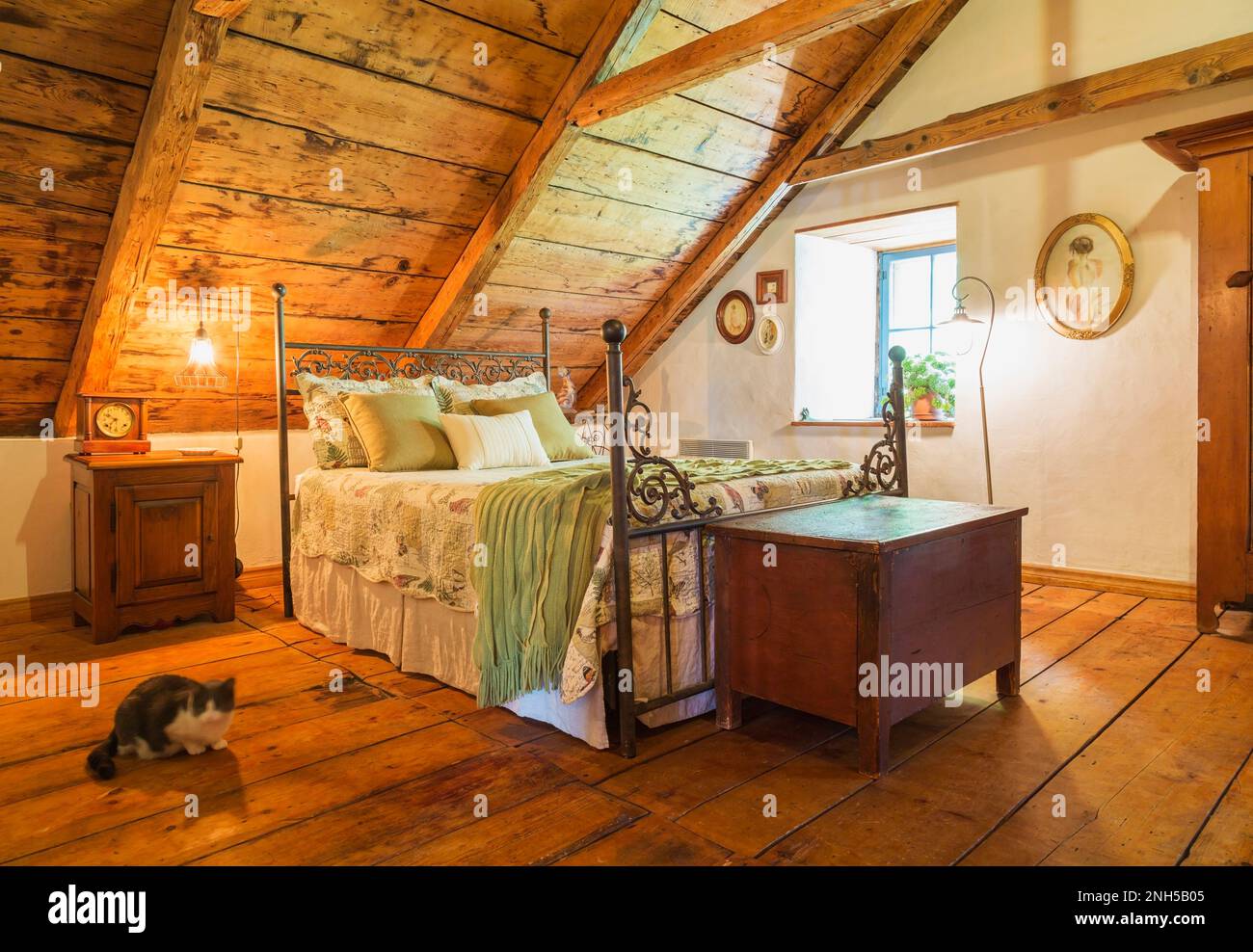 Queen size four poster bed with antique metal headboard and footboard ...