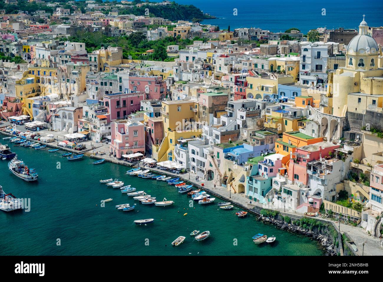 View of the Port of Corricella with lots of colorful houses on a sunny ...
