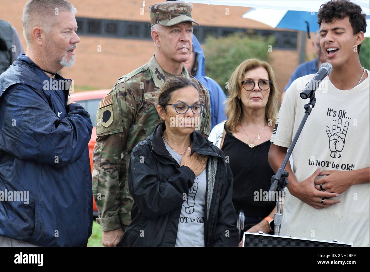 Mason Copeland sings the National Anthem as Maj. Gen. Rich Neely, the ...