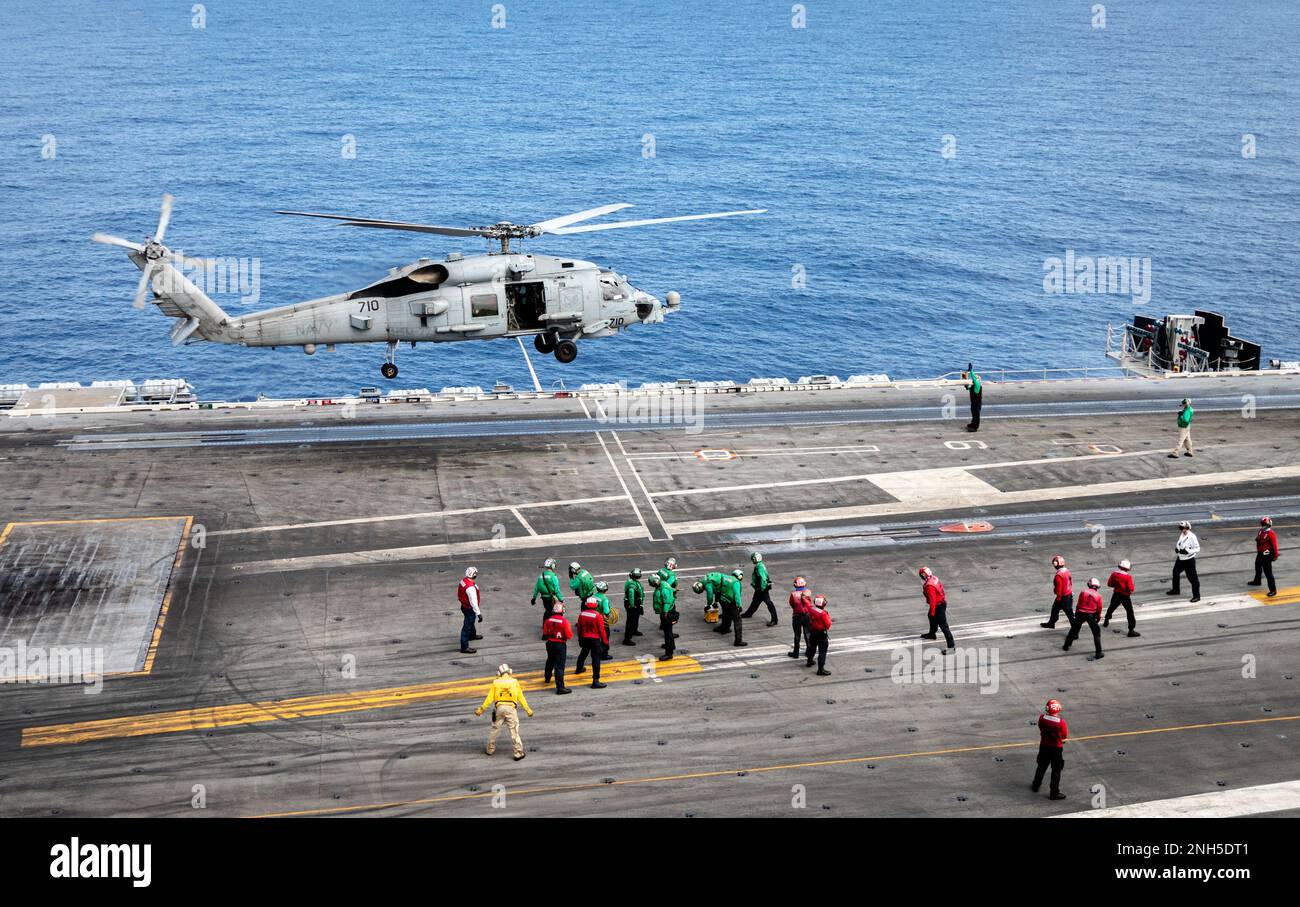 220717-N-WI365-1011 SOUTH CHINA SEA (July 17, 2022) Sailors observe an ...