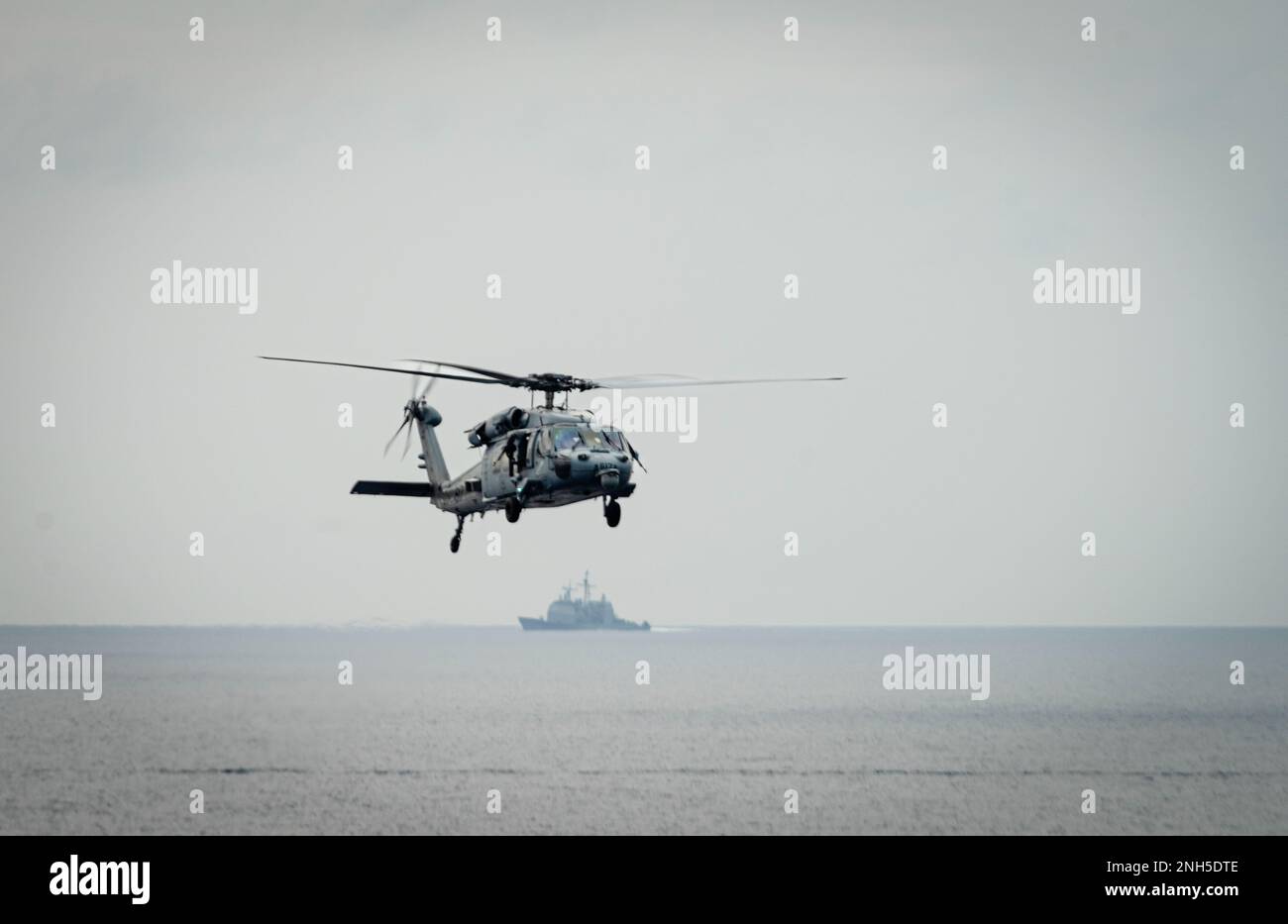 220717-N-WI365-1281 SOUTH CHINA SEA (July 17, 2022) An MH-60S Sea Hawk ...