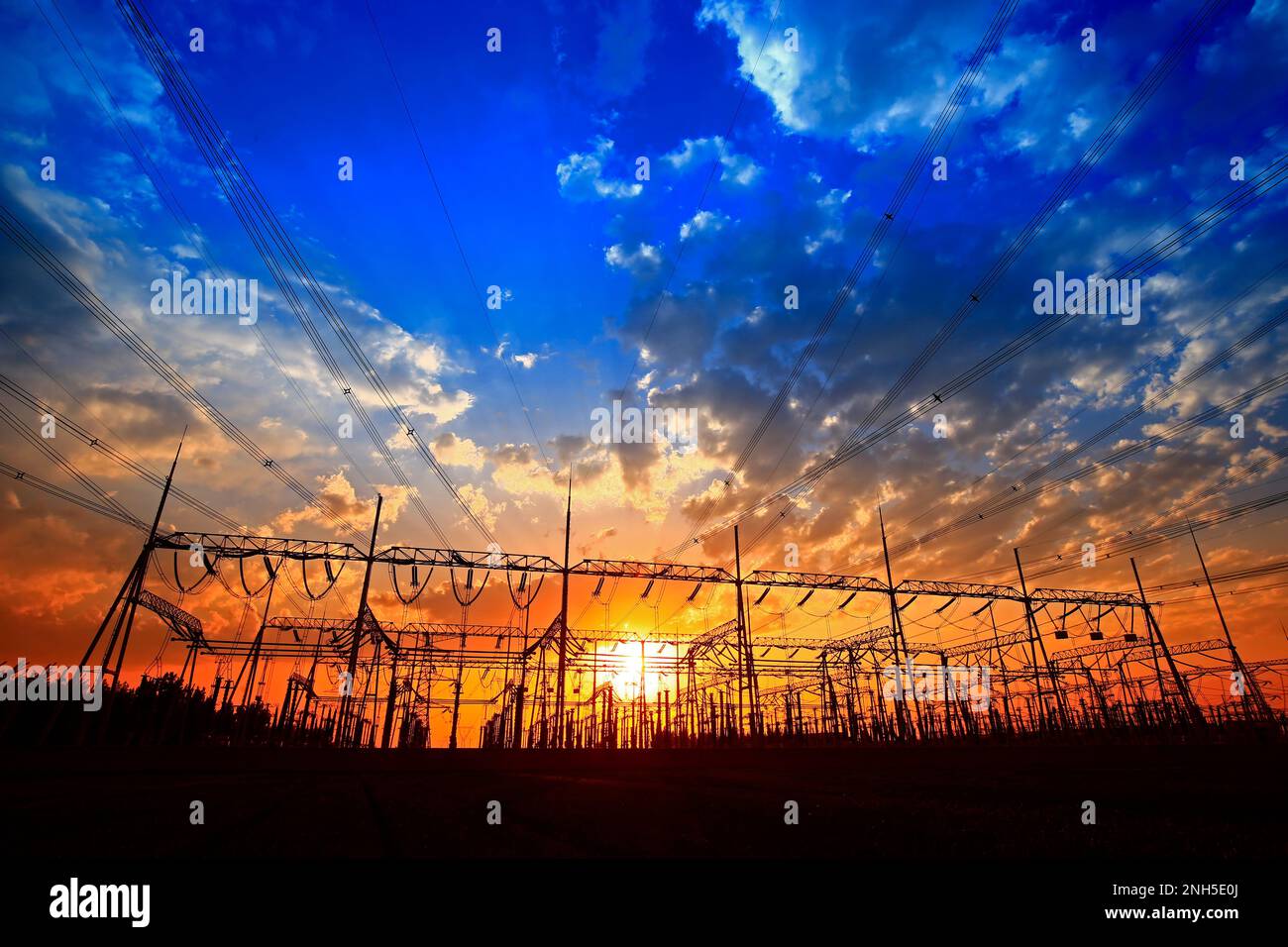 Electric tower, silhouette at sunset Stock Photo - Alamy