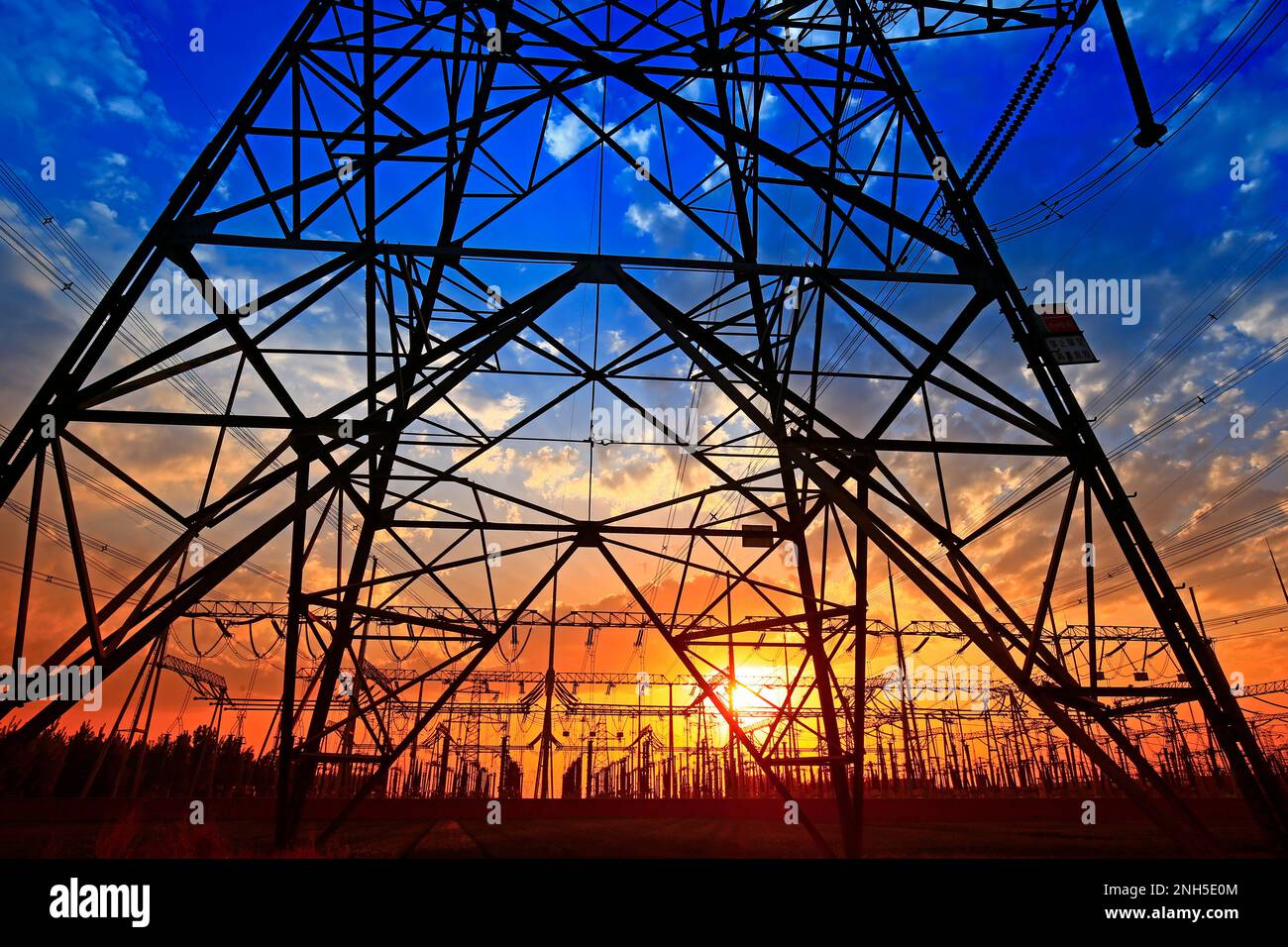 Electric tower, silhouette at sunset Stock Photo - Alamy