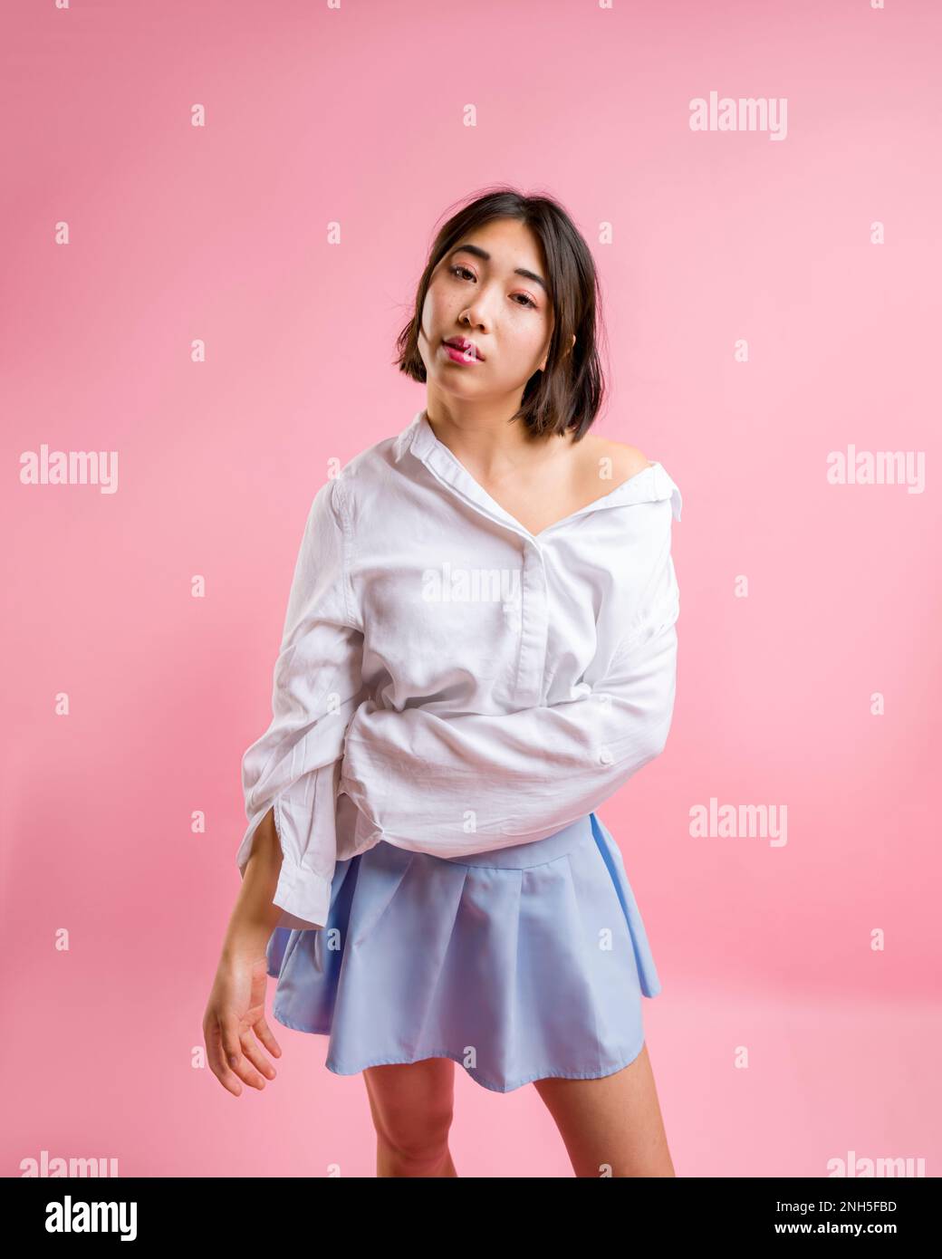 3 4 Body Asian Woman Standing Facing Camera White Blouse Blue Short