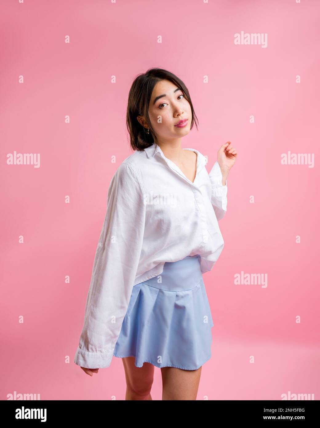 34 Body Asian Woman Standing Facing Camera White Blouse Blue Short Skirt Facing Camera Pink