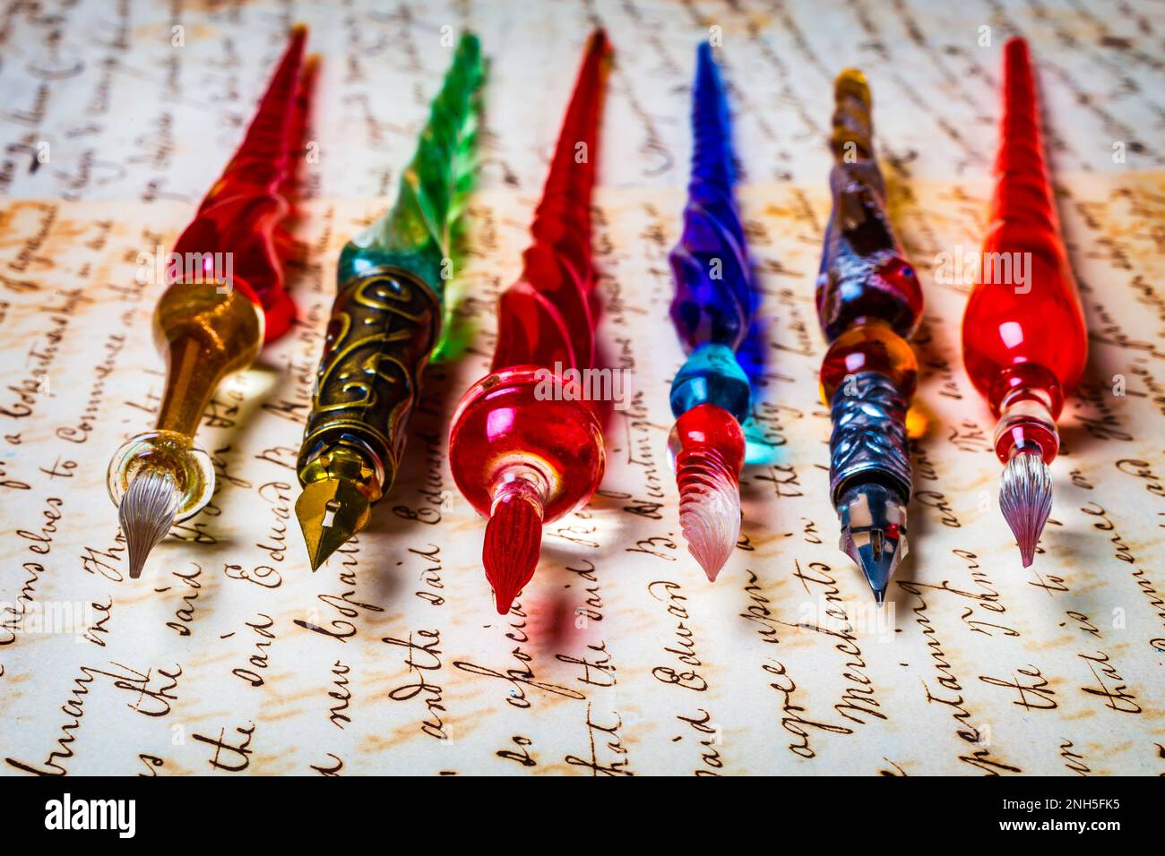 Fine Glass Pens laying on letter, document, writing, message ...