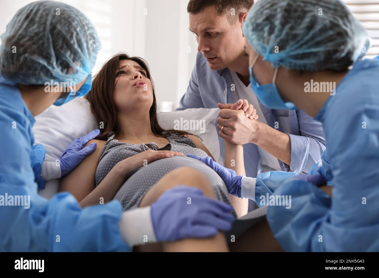 Woman giving child birth in maternity hospital Stock Photo - Alamy