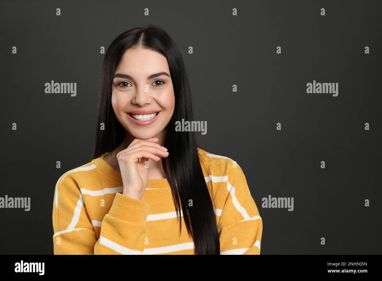 Portrait Of Happy Young Woman With Beautiful Black Hair And Charming