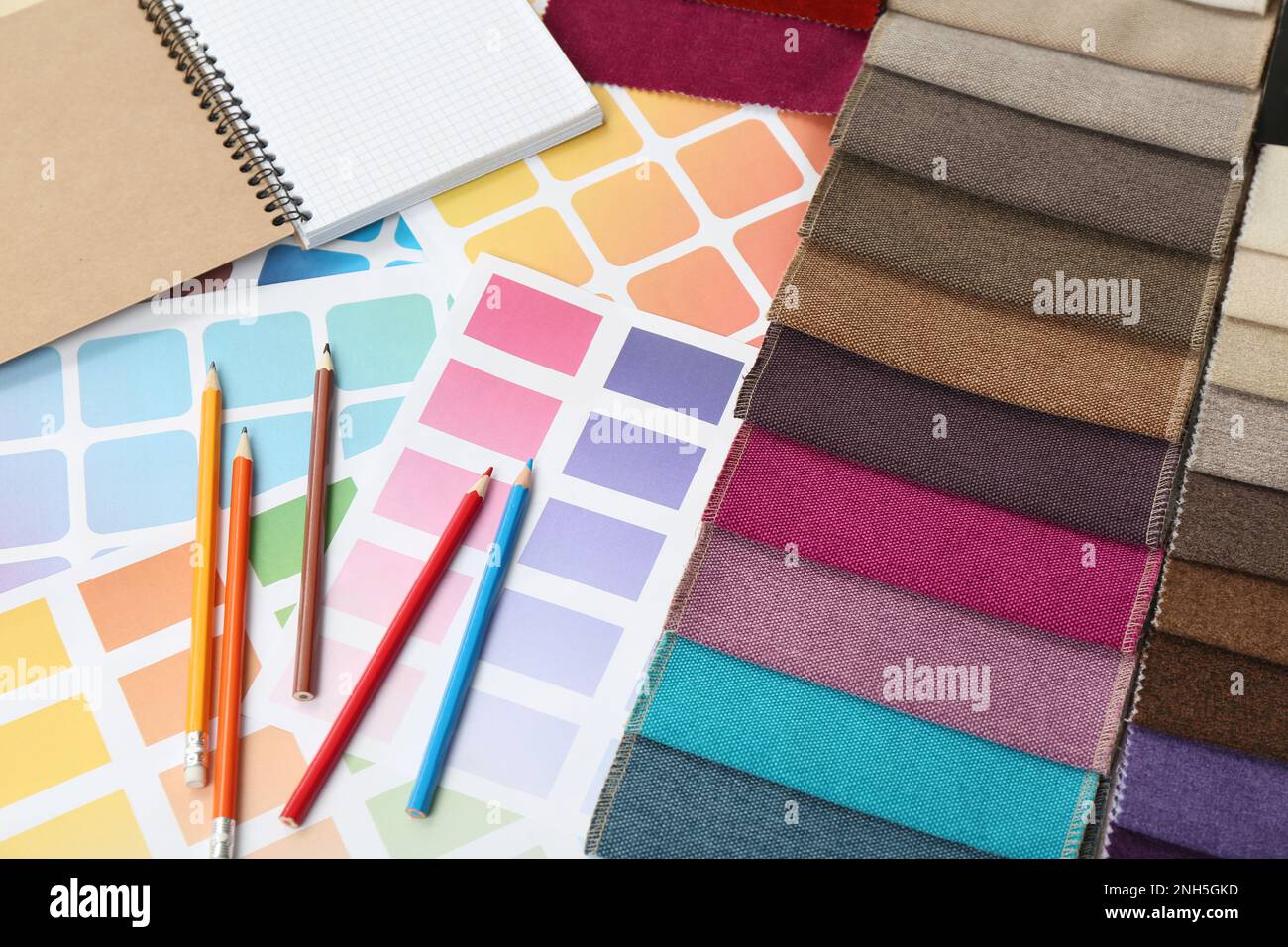 Upholstery fabric samples, pencils and color palette Stock Photo - Alamy