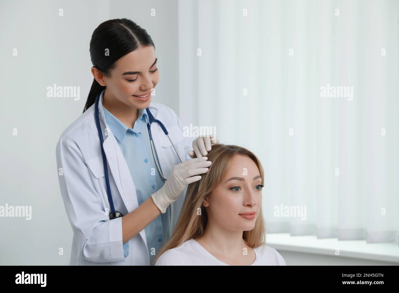 Dermatologist examination young woman hi-res stock photography and ...