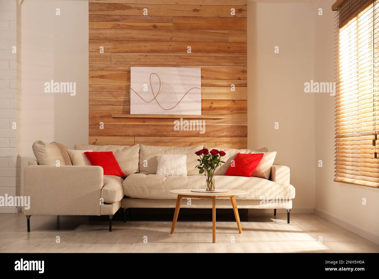 Modern comfortable sofa near wall in room. Interior design Stock Photo ...