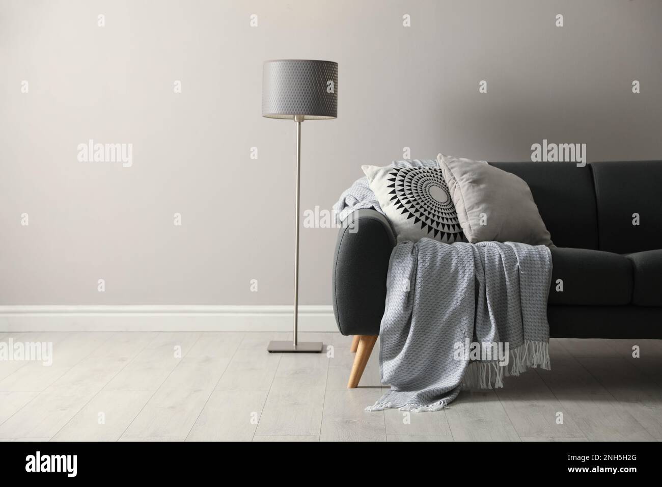 Stylish comfortable sofa in room, space for text. Interior design Stock ...
