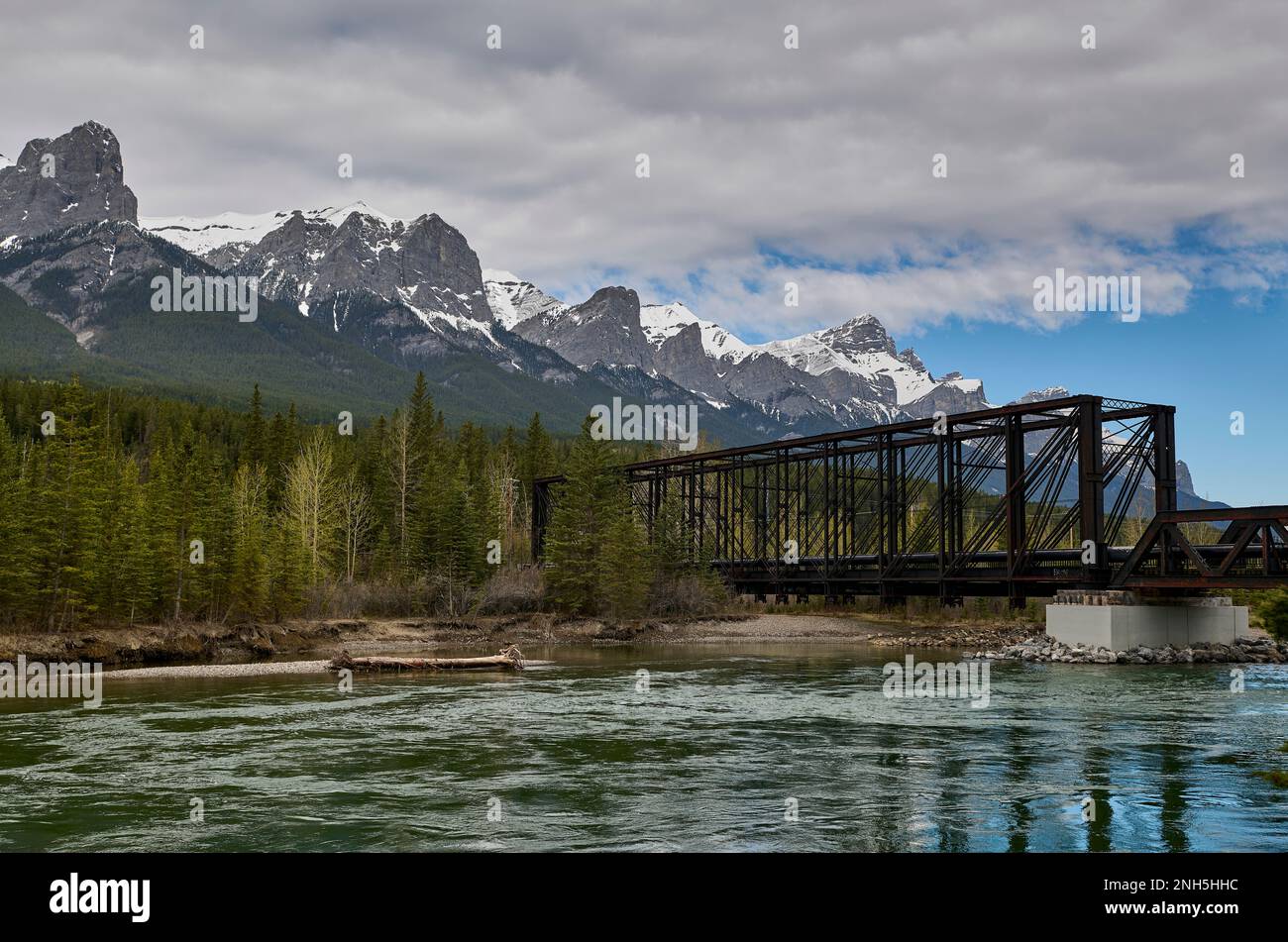 The Old Engine Bridge over the Bow River with Rundle Mountain peak ...