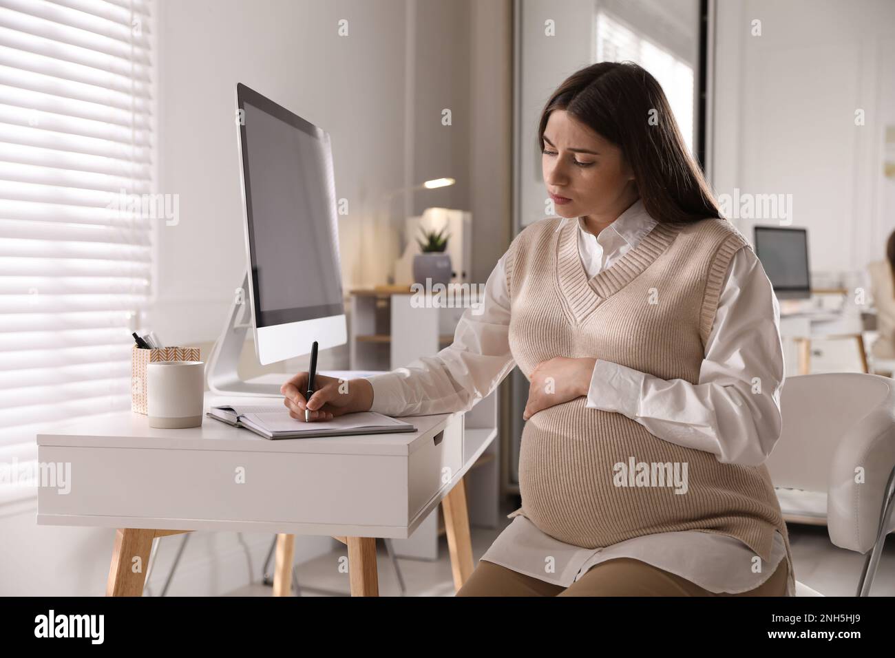 Pregnant at work with tea hi-res stock photography and images - Alamy