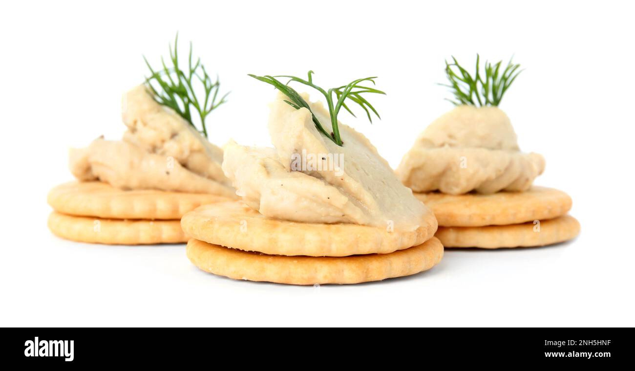 Delicious crackers with humus and dill on white background Stock Photo ...