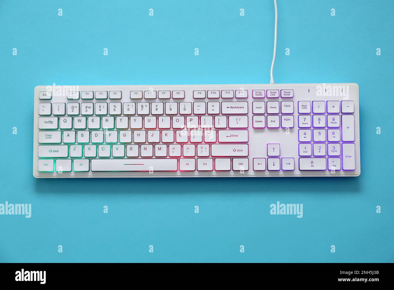 Modern RGB keyboard on turquoise background, top view Stock Photo - Alamy
