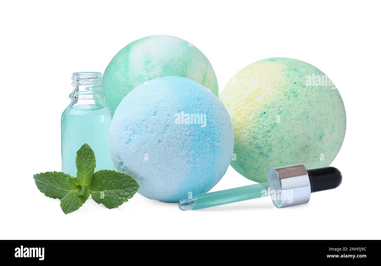 Fragrant bath bombs, oil and mint on white background Stock Photo - Alamy