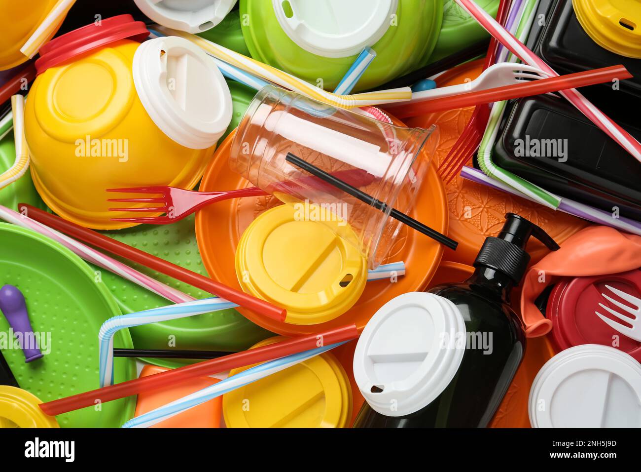 Different colorful plastic items as background, closeup Stock Photo - Alamy
