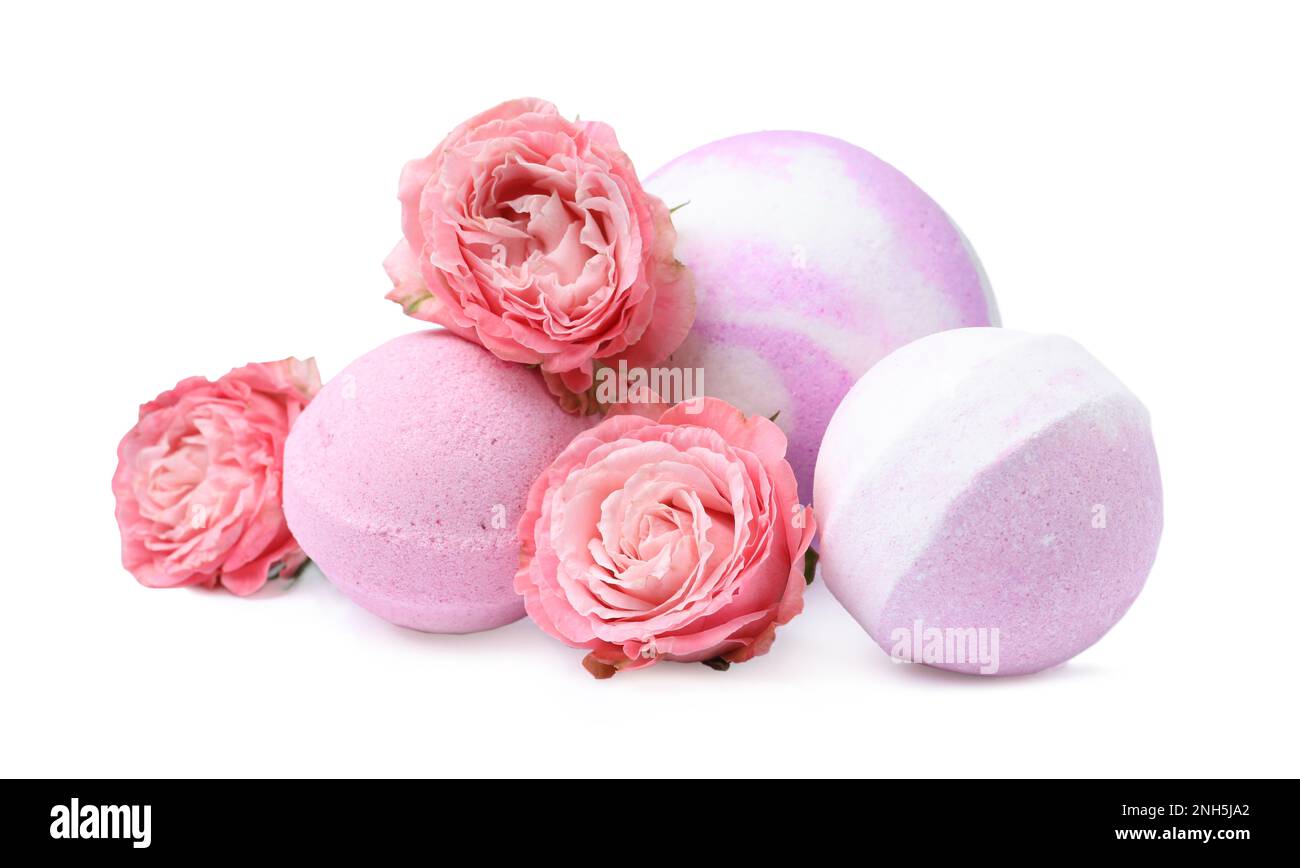 Fragrant bath bombs and rose flowers on white background Stock Photo ...