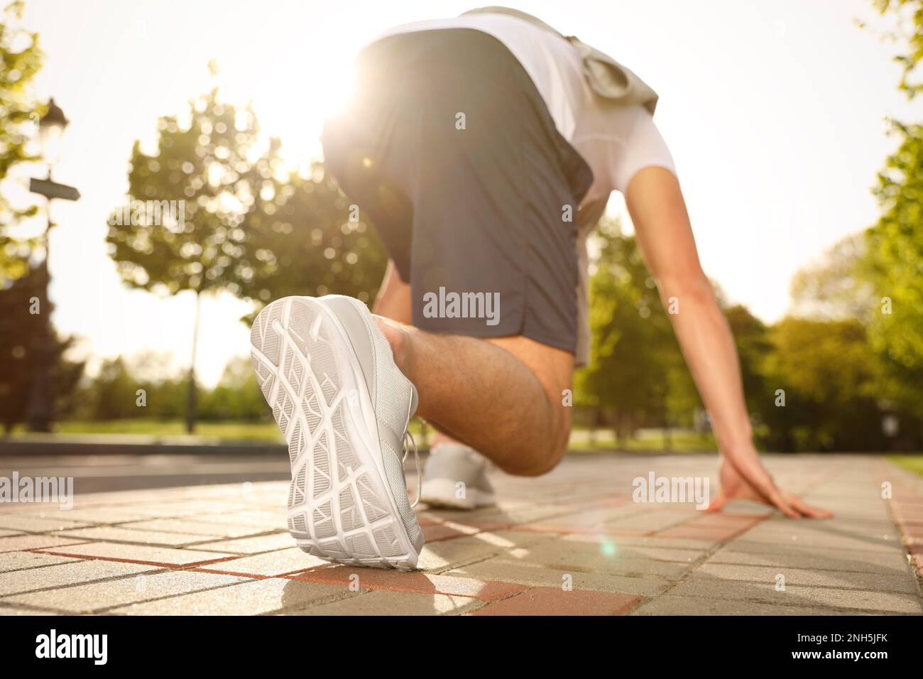 Man in fitness clothes ready for running outdoors, low angle view Stock ...