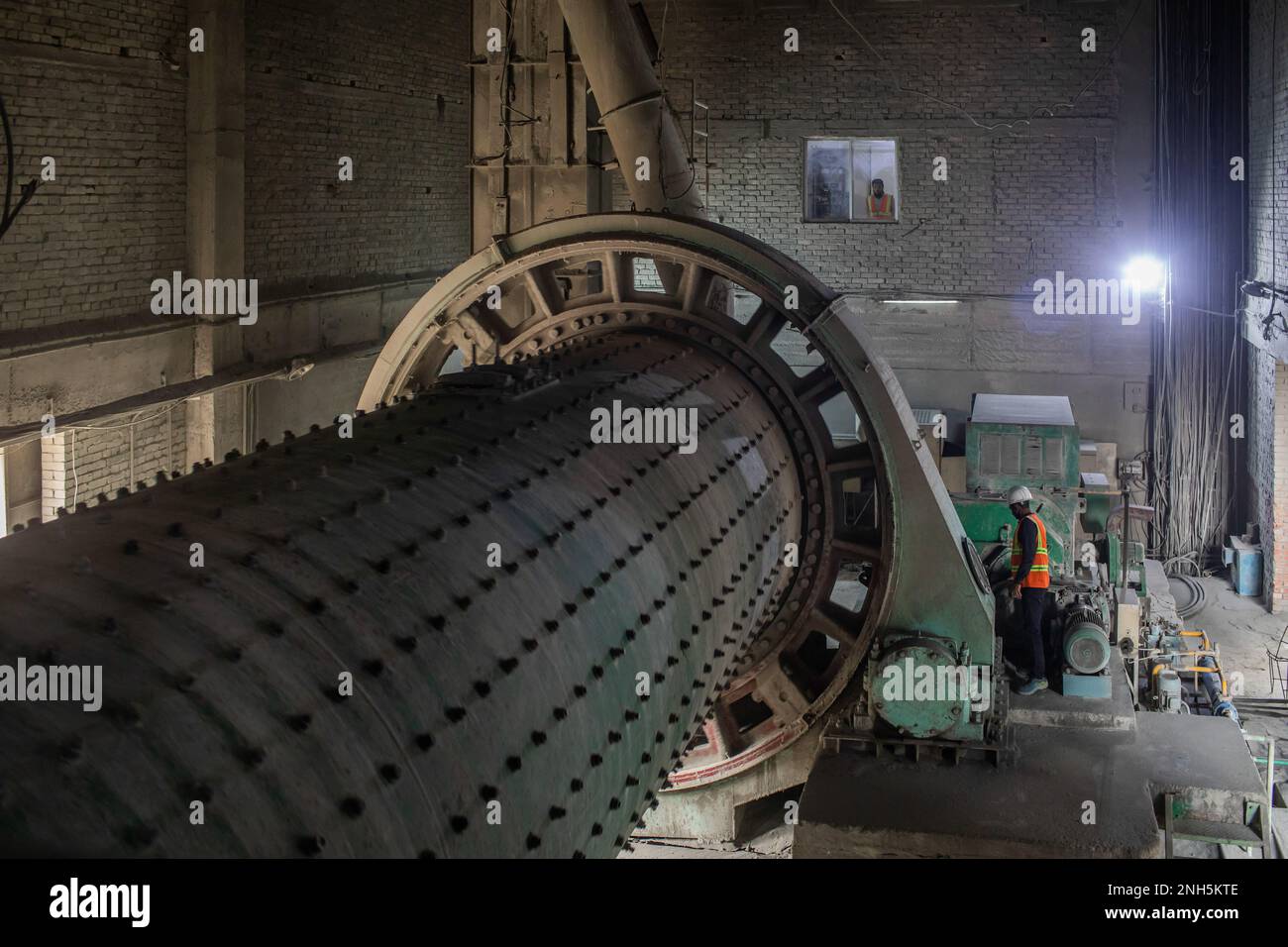 A worker seen in the construction department at the Mir cement plant ...