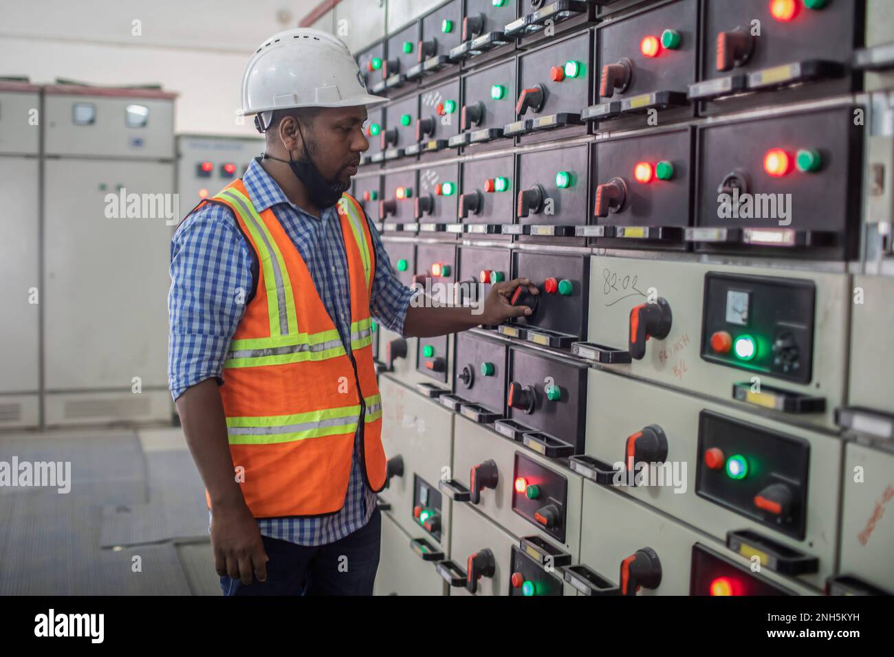 A worker operates a machine at the Mir cement plant. Mir Cement Ltd is ...