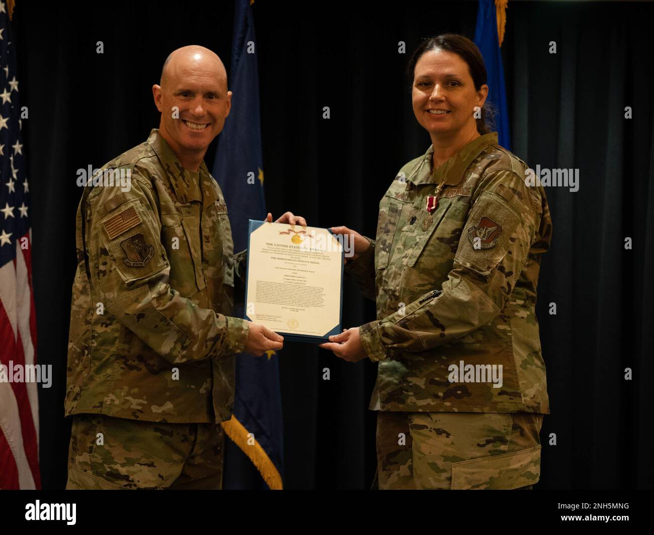 U.S. Air Force Lt. Col. Jennifer Mack, right, is awarded the ...