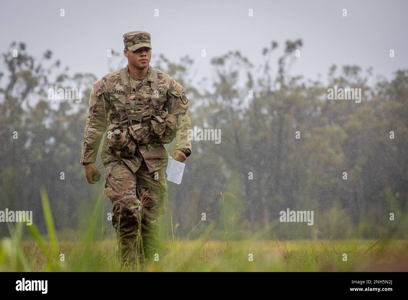 Spc. Ikena Tarape assigned to 8th Military Police Brigade walks to his ...
