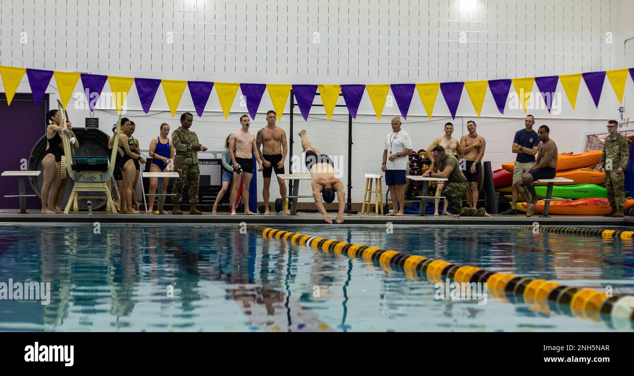 CIOR participants cheer on a teammate as he dives into the pool in ...