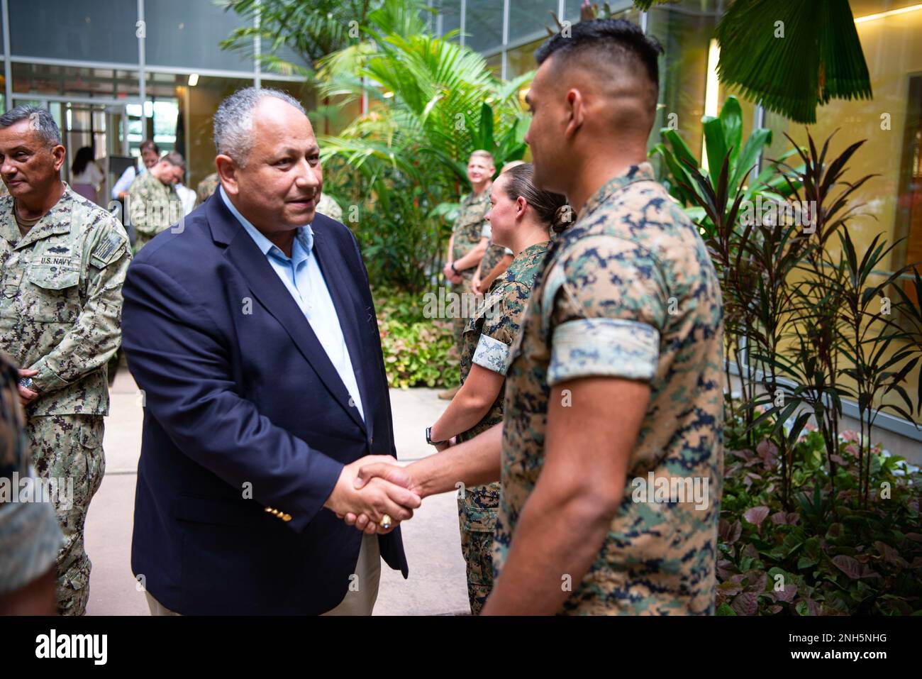 Secretary of the Navy Carlos Del Toro greets a Marine during a tour at ...