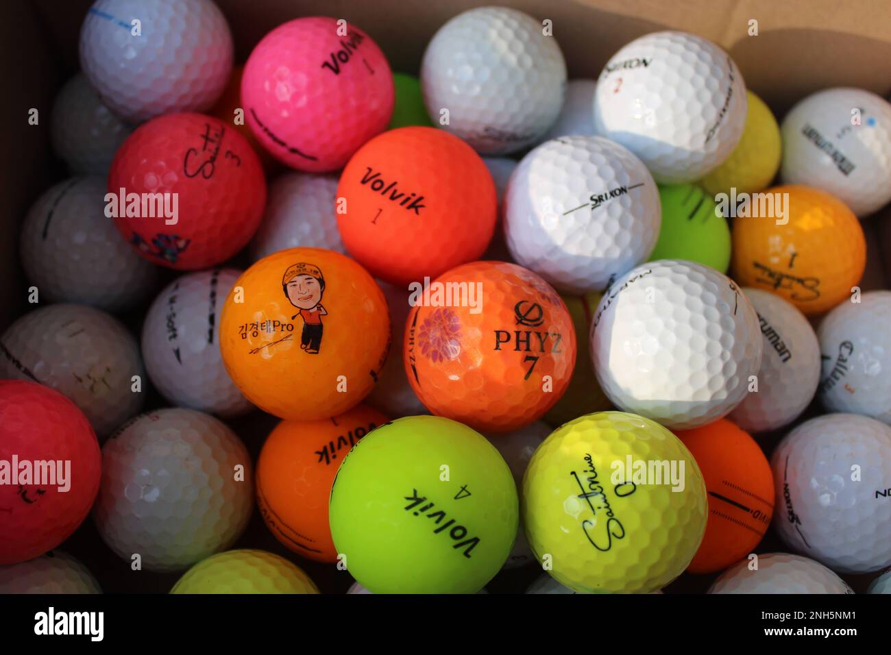Colorful golf balls in cardboard box Stock Photo - Alamy