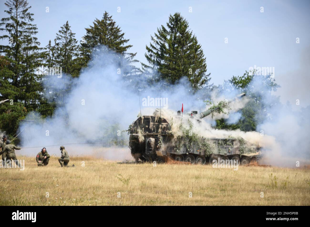 German soldiers assigned to Artilleriebataillon 131 fire munitions from ...