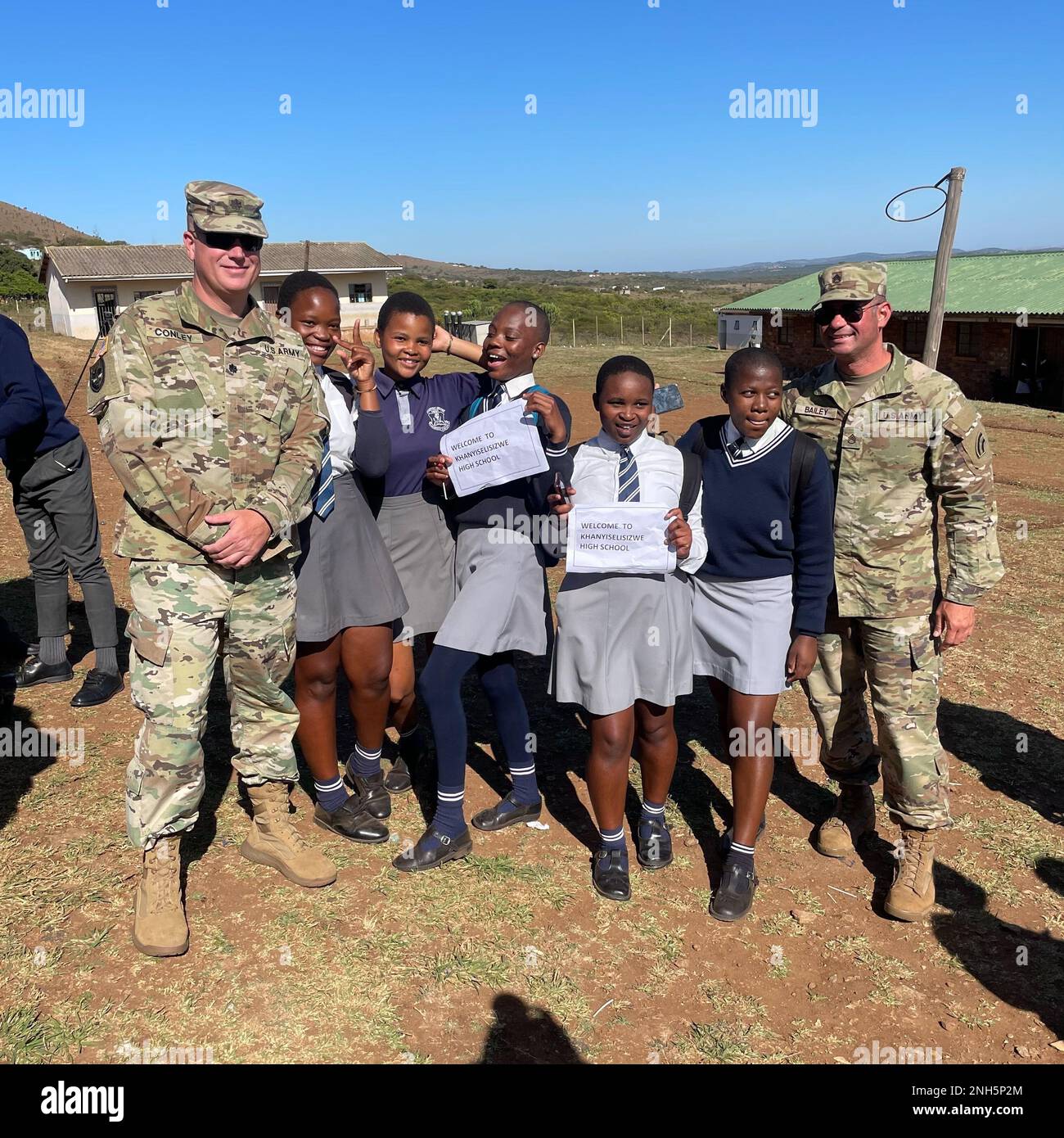 Lt. Col. Joseph Conley and Staff. Sgt. David Bailey stand with students ...