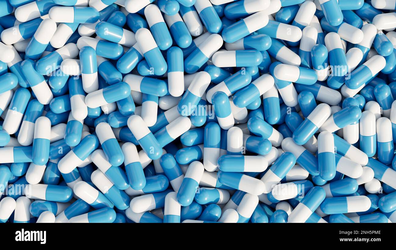 Pile of pills background, pill capsules in white and blue. drug or ...