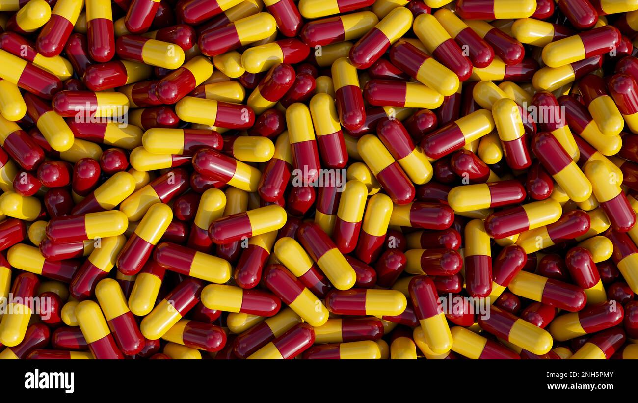 Pile of pills background, pill capsules in yellow and red. drug or ...