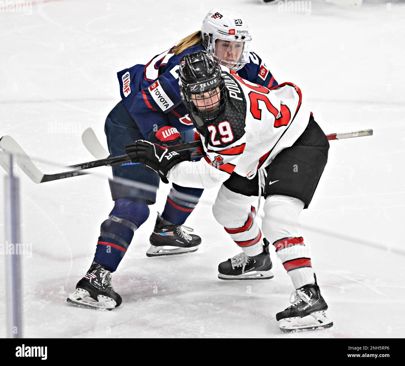 Team Canada Marie-Philip Poulin (29) and Team USA Hannah Brandt battle ...