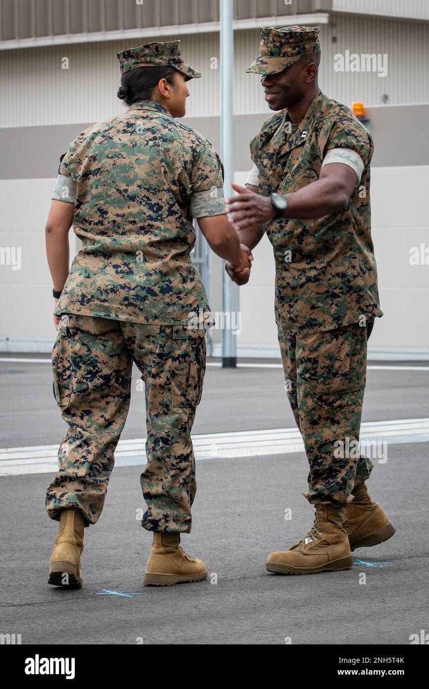 U.S. Marine Corps Capt. Alusine Kamara, right, shakes hands with 1st ...