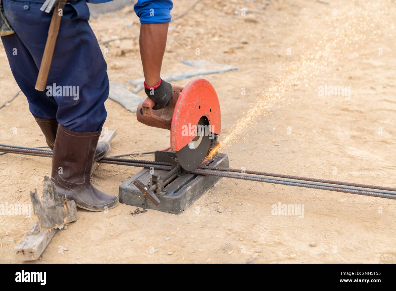 Worker cut steel bar with electric fiber cutting sparks fire while ...