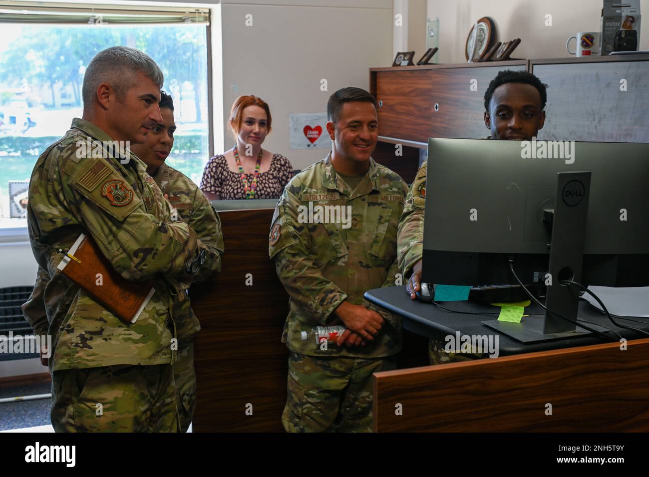 Leadership from the 39th Air Base Wing watch as an Airman assigned to ...