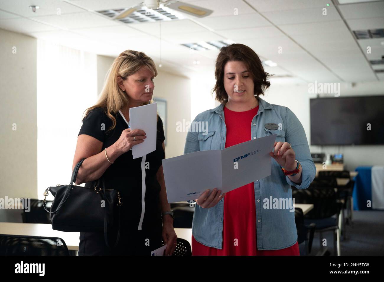 Mrs. Abby Johnson (right) briefs Mrs. Terrie Hecker (left) on the ...