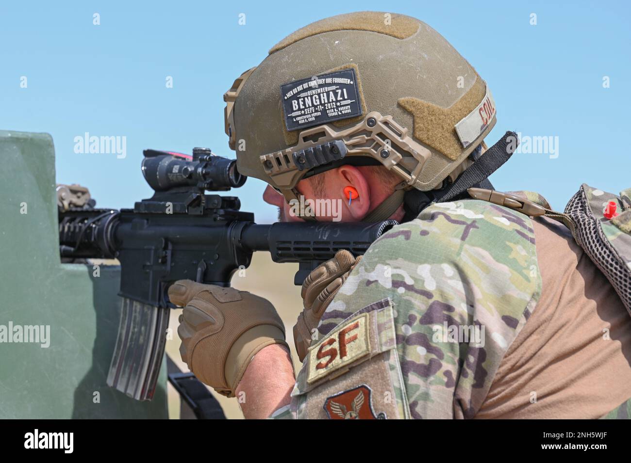 Staff Sgt. Jay Coil, defender in the 890th Missile Security Forces Squadron, aims his weapon at ...