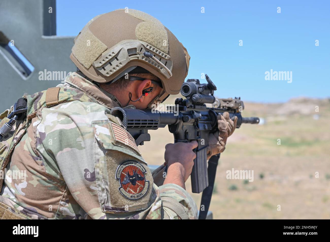 Airman Andres Metzler, defender in the 890th Missile Security Forces Squadron, aims his weapon ...