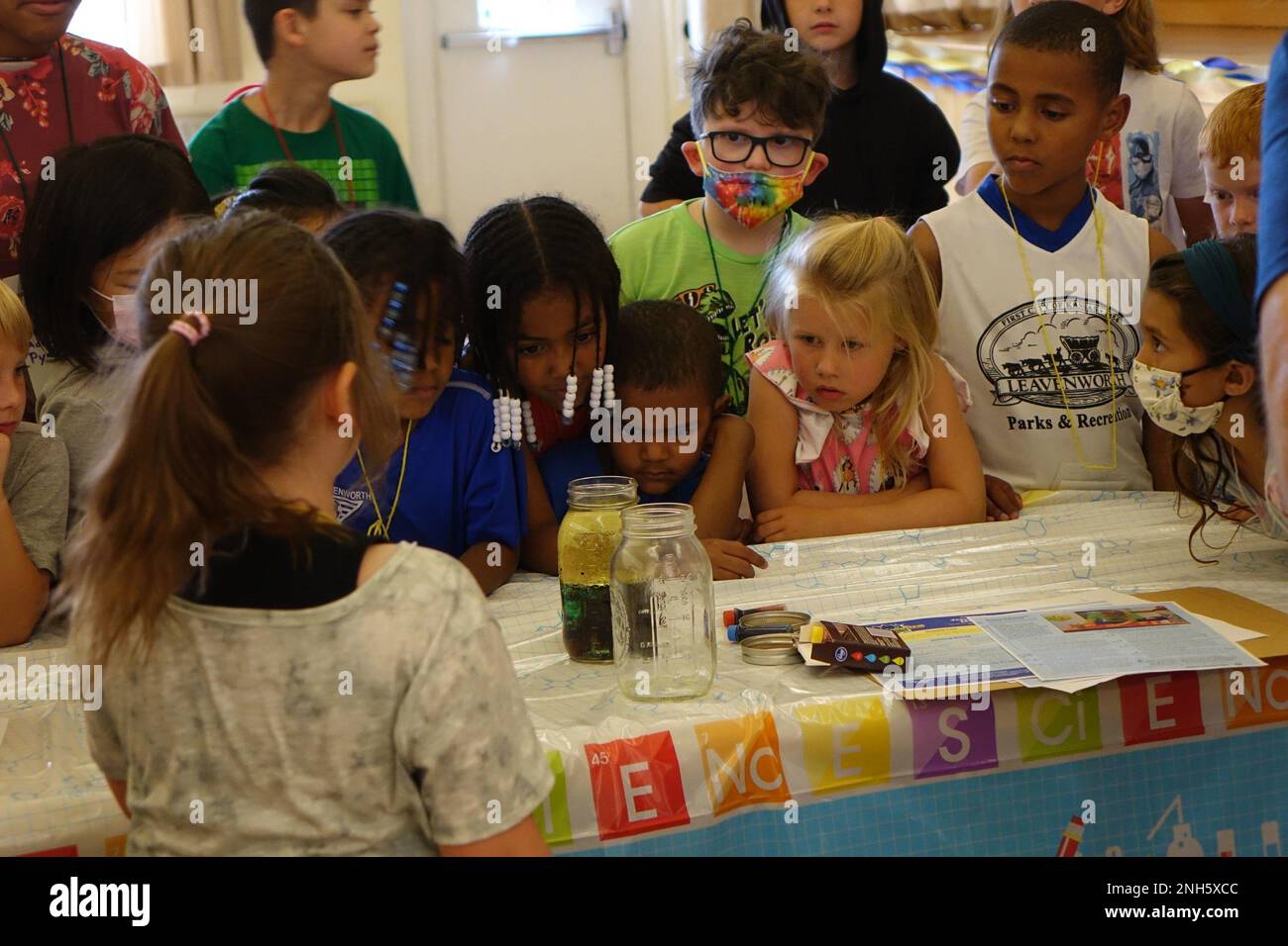 Vacation Bible School volunteer, Katherine Scully, helps with arts and ...