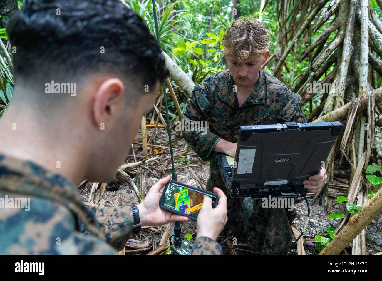 U.S. Marine Corps 1st Lt. Isaac Chesler, left, a communications officer ...