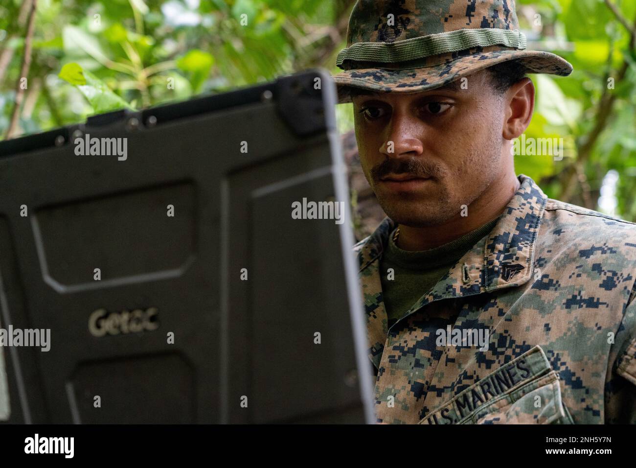 U.S. Marine Corps Cpl. Christian Harrison, a radio operator with Task ...