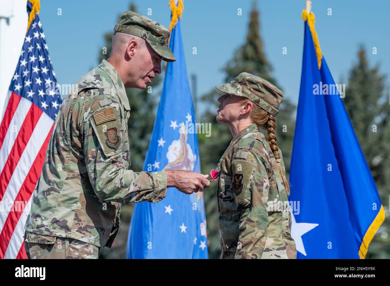 Maj. Gen. Michael Lutton, left, 20th Air Force commander, pins a Legion ...